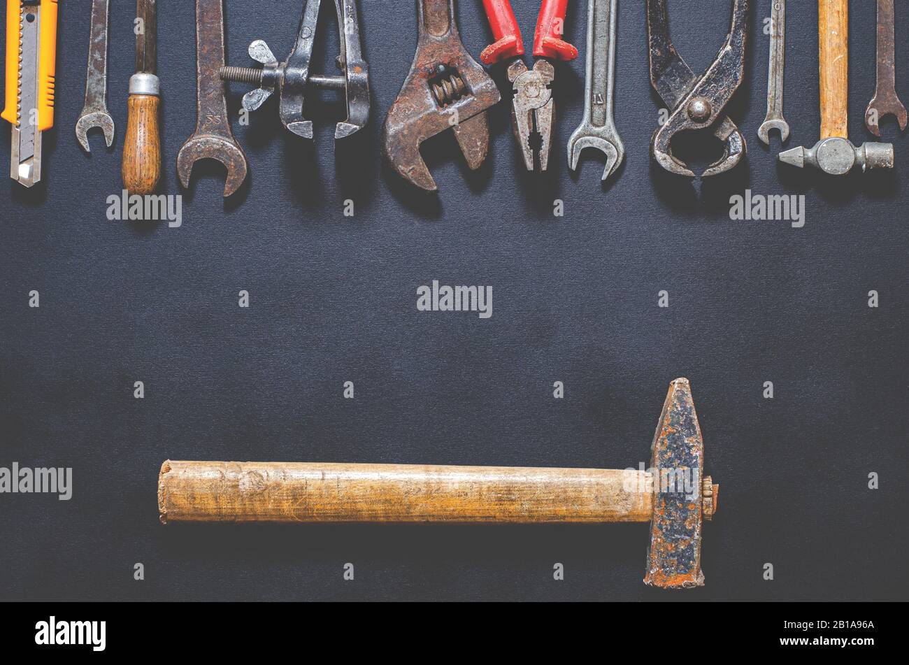 Tools for repair and reconstruction in home conditions lie on a black ...