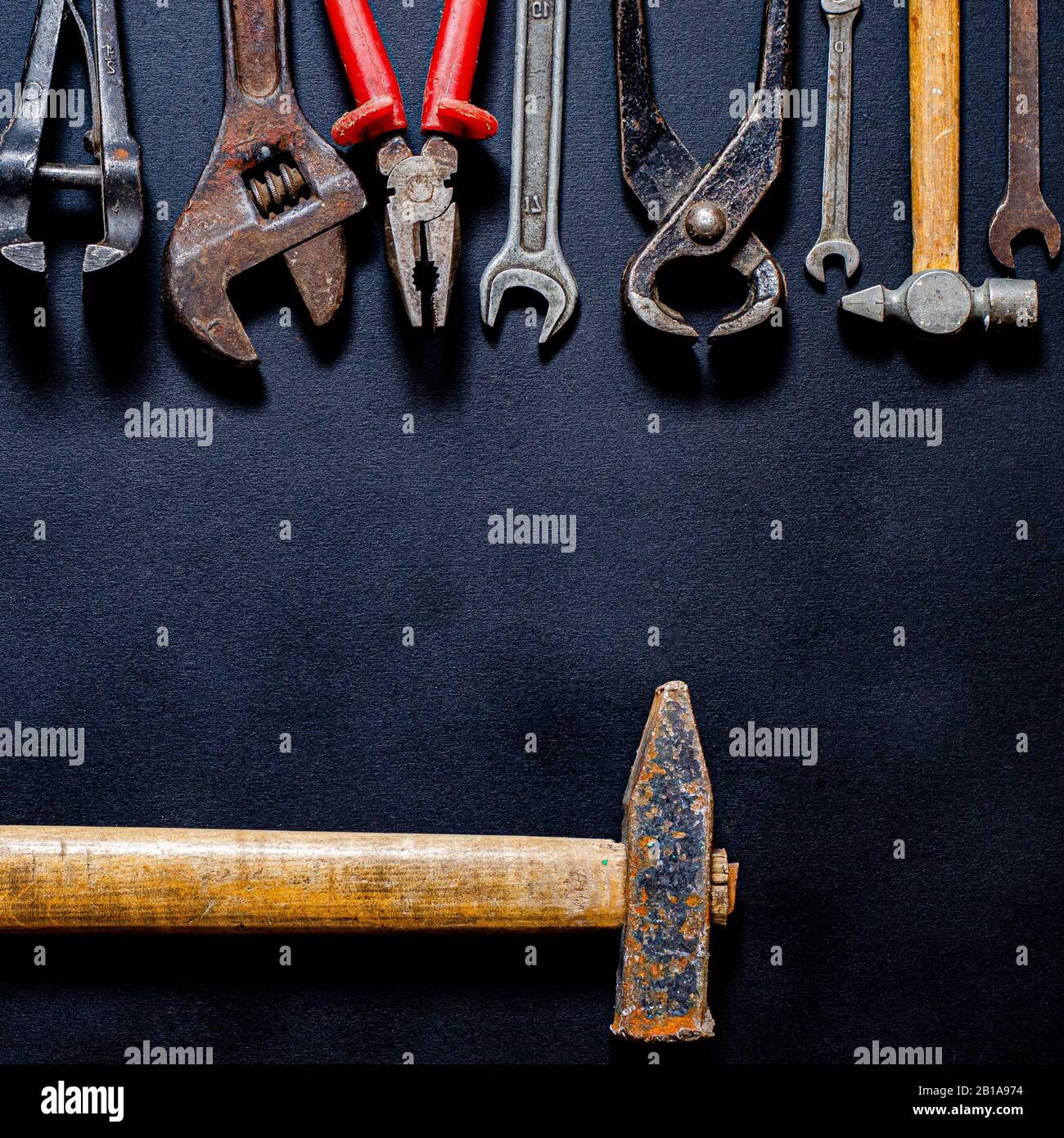 Tools for repair and reconstruction in home conditions lie on a black ...