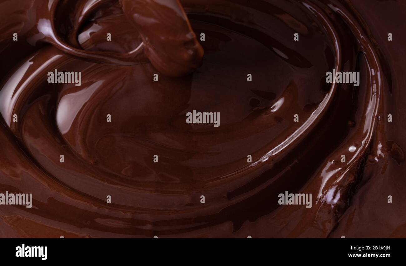 Chocolate texture. Liquid chocolate close-up.Textured dark chocolate ...