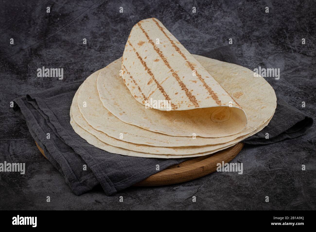 Stack of corn tortillas on dark background. Mexican food Stock Photo ...