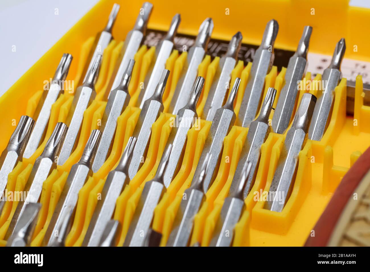 Screwdriver bits in a plastic container closeup Stock Photo - Alamy