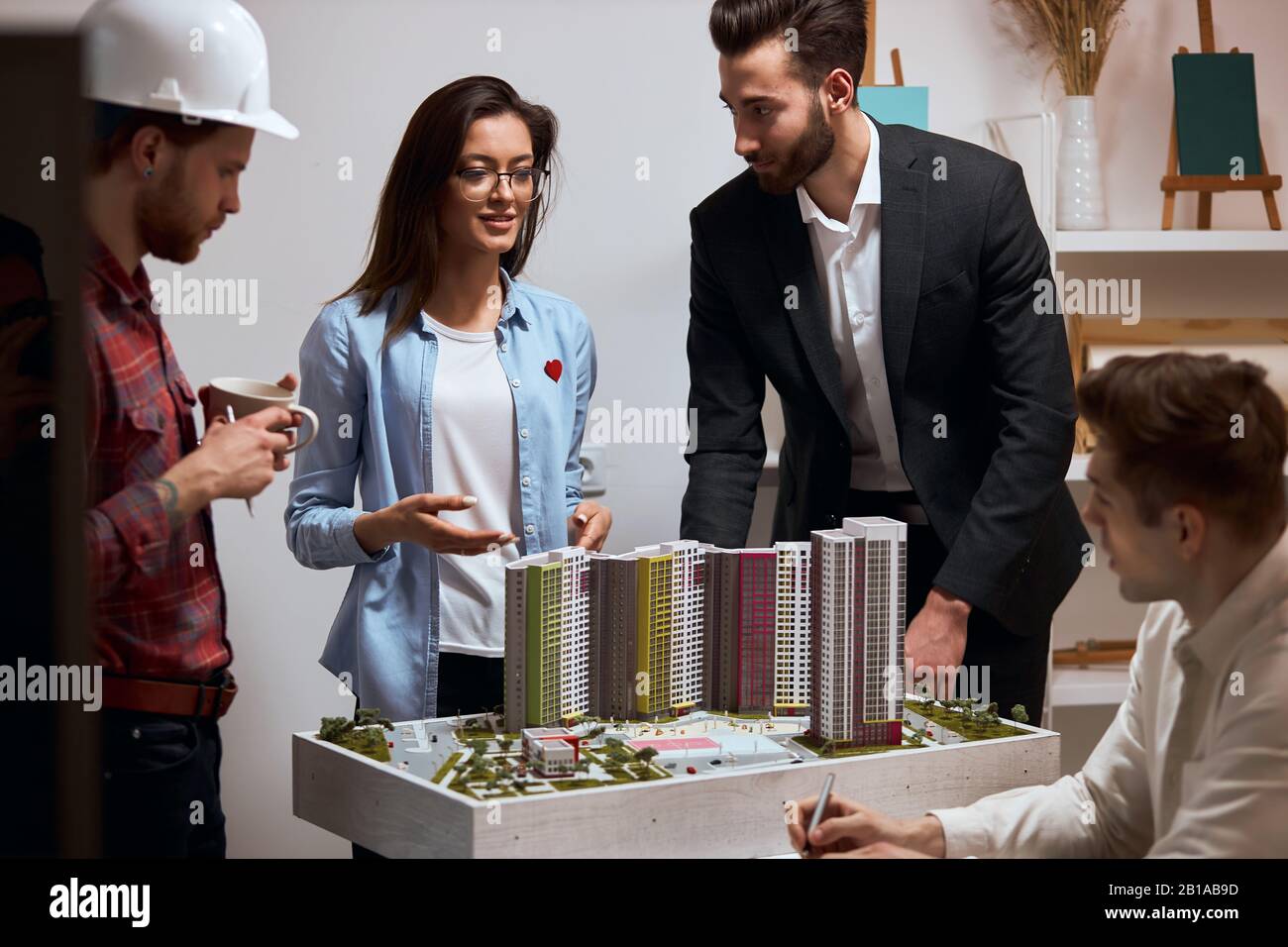 Male architects presenting model hi-res stock photography and images ...