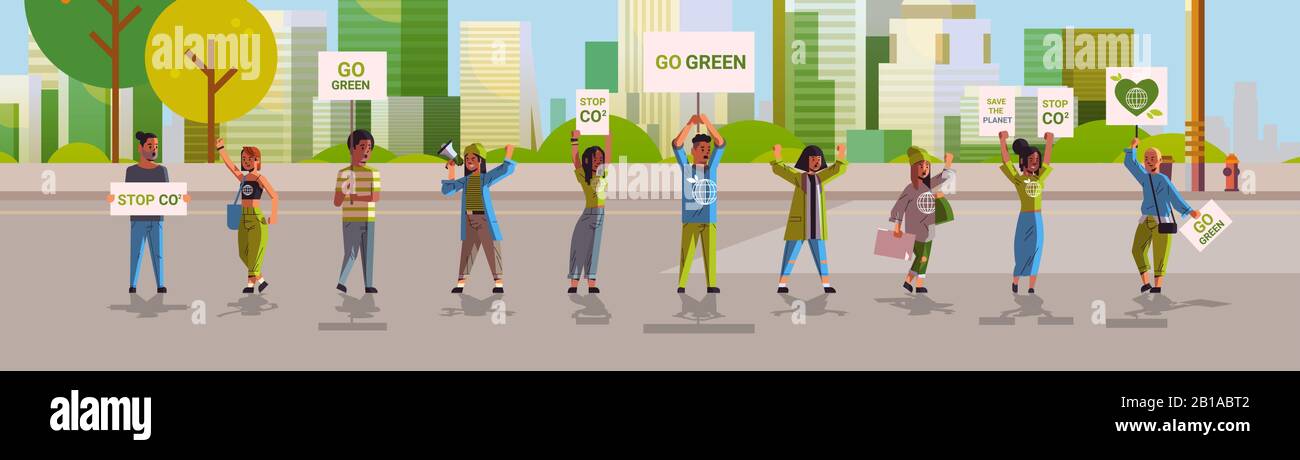 environmental activists holding posters go green save planet strike ...