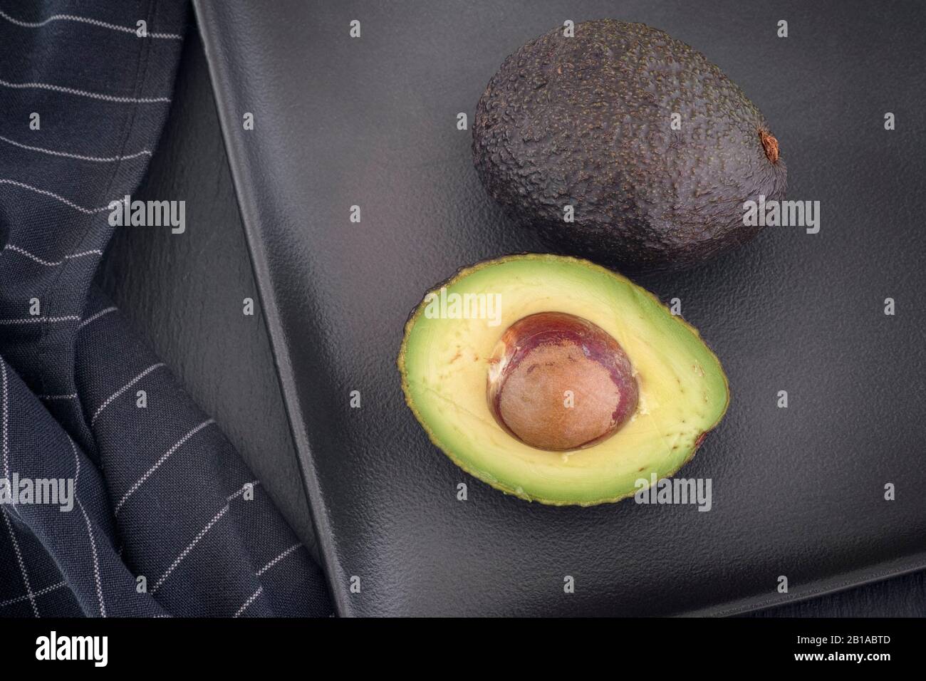 Avocado in a plate. Top view Stock Photo - Alamy