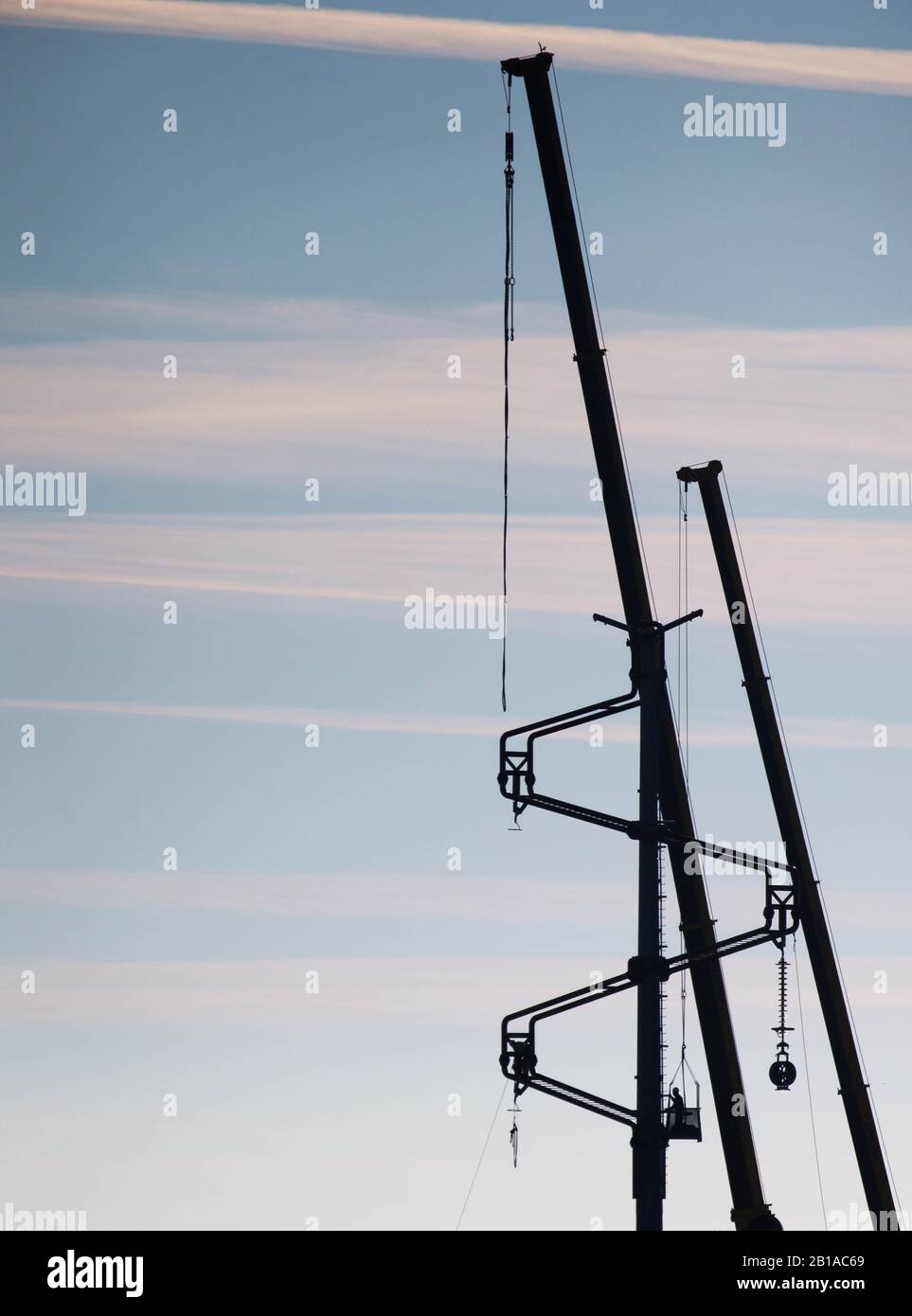 Power line work silhouette hi-res stock photography and images - Alamy
