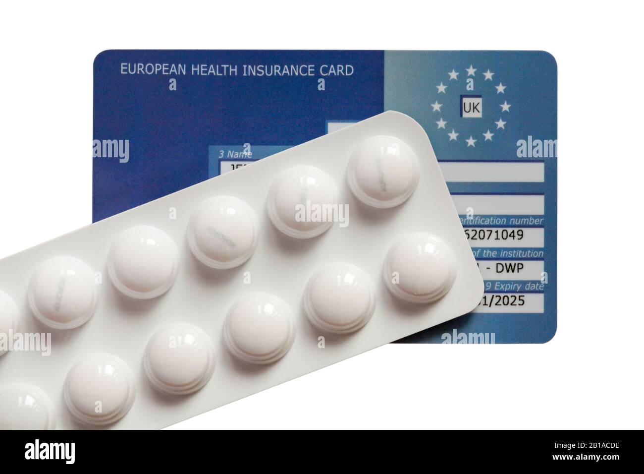 EHIC card with pack of tablets set on white background - European ...