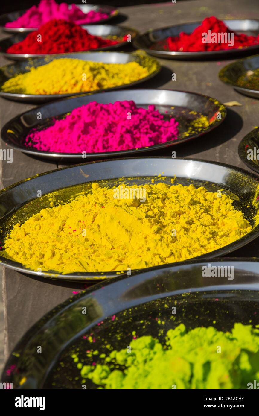 Trays with colourful powders set for Holi. This festival marks the ...