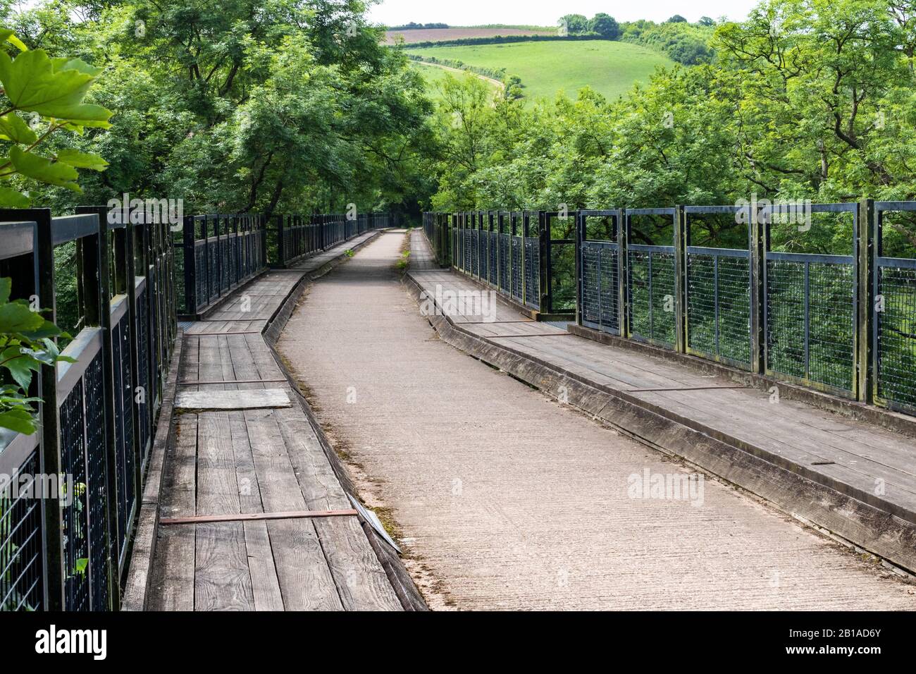 Summer Tree Lined View of the Old Iron Railway Bridge on the Tarka ...