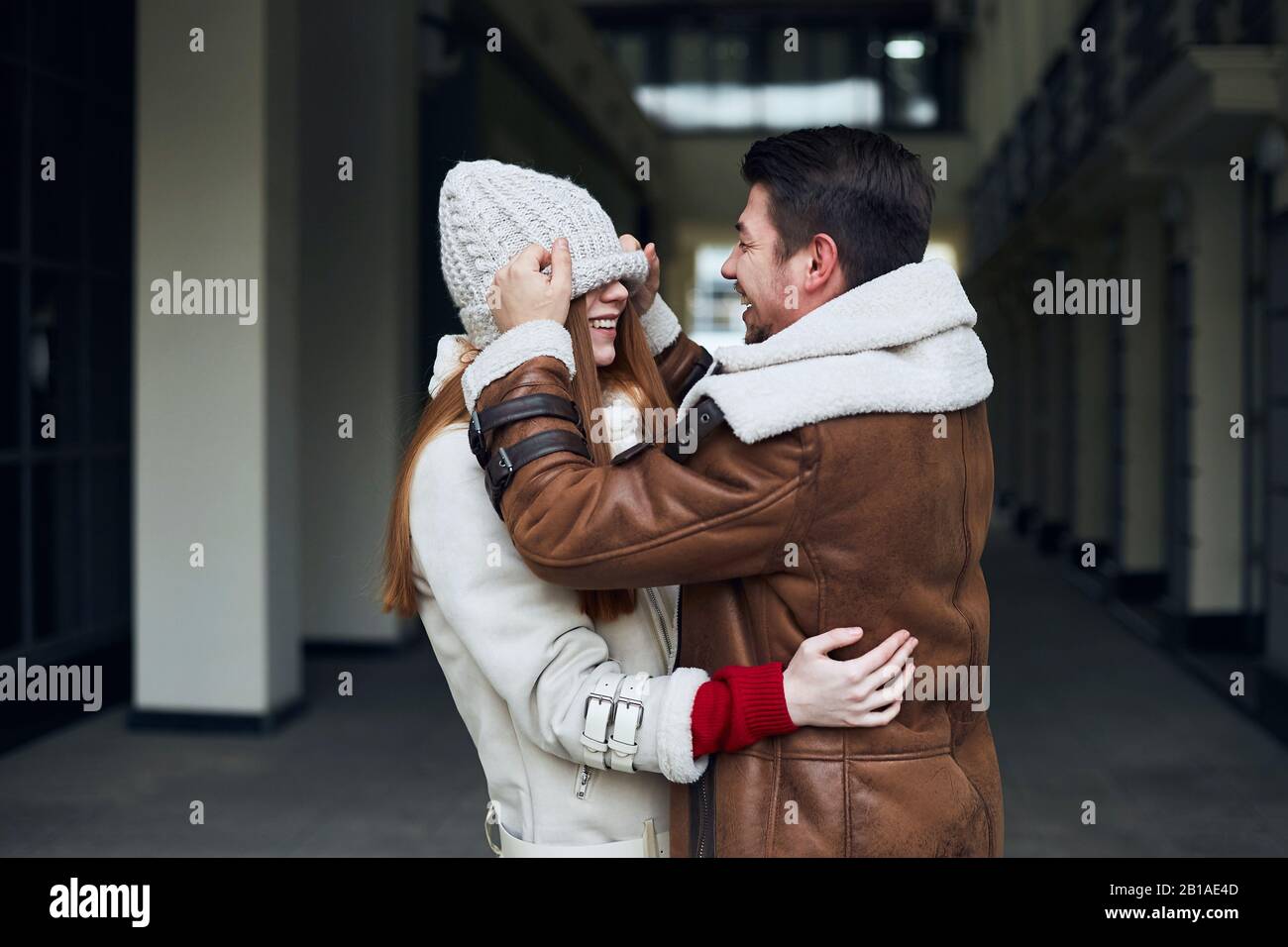 young people playing hide and sick outdoors, close up side view photo ...