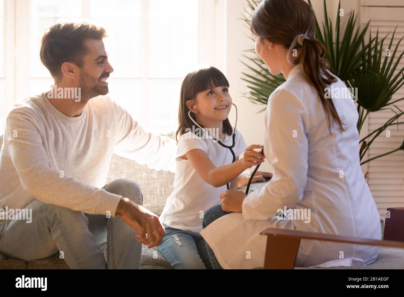 Happy family have fun playing doctor game together Stock Photo - Alamy
