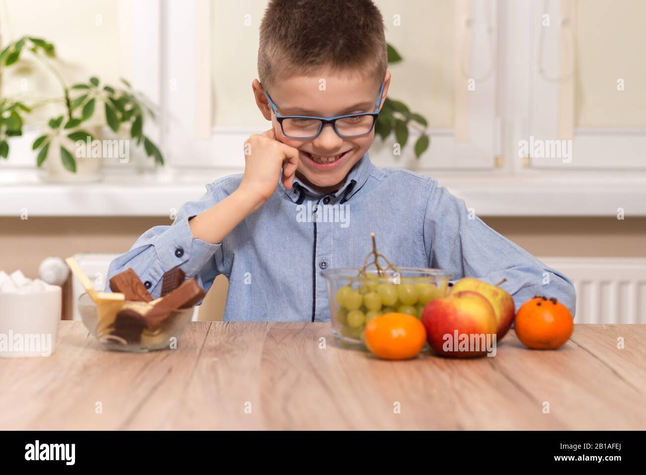 Boy chooses fruit hi-res stock photography and images - Alamy