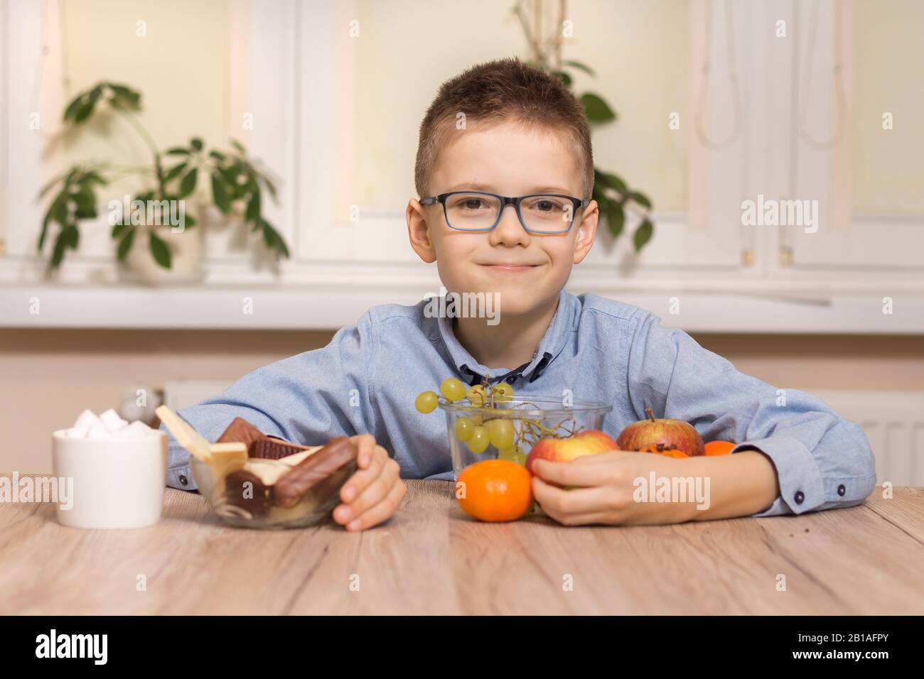 Boy chooses fruit hi-res stock photography and images - Alamy