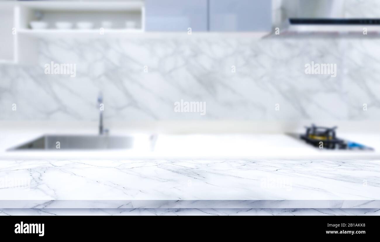 White marble texture table top on blurred kitchen background Stock ...