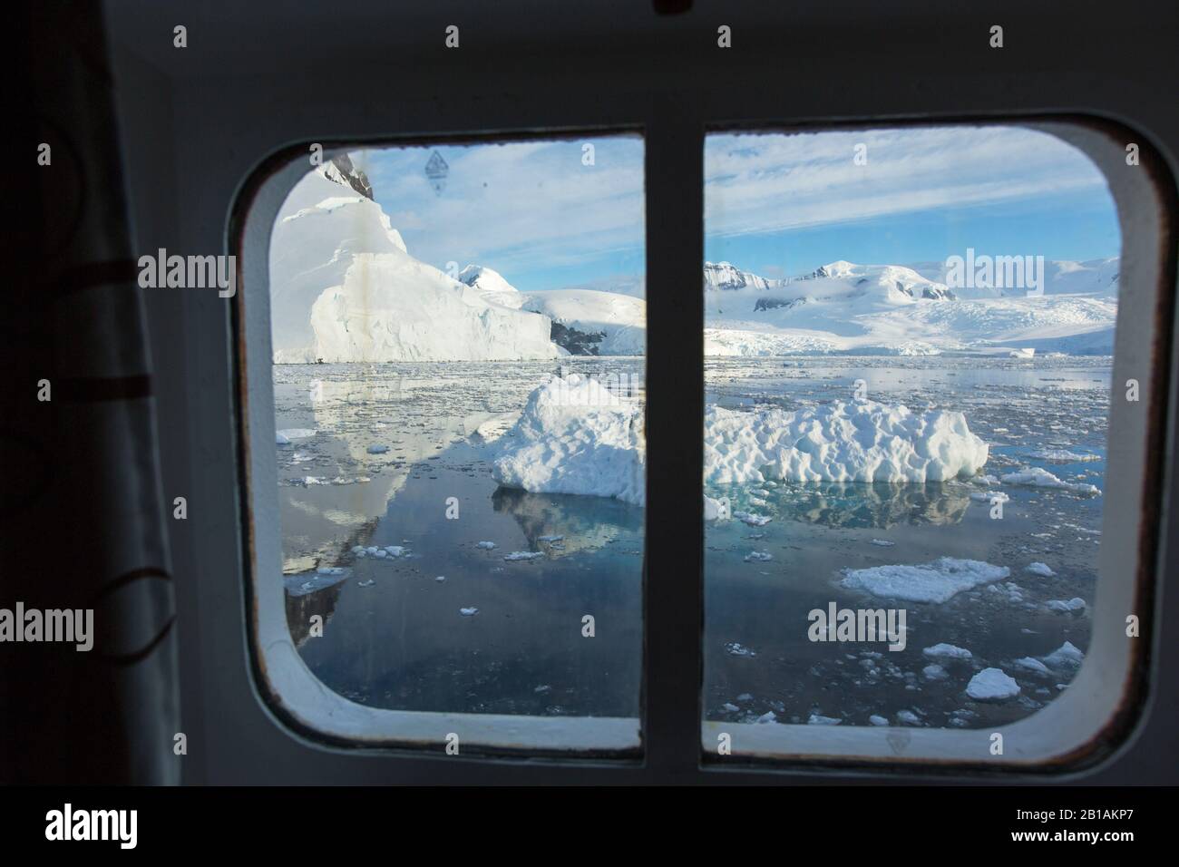 Looking out of a cabin window on an expedition cruise ship onto the ...