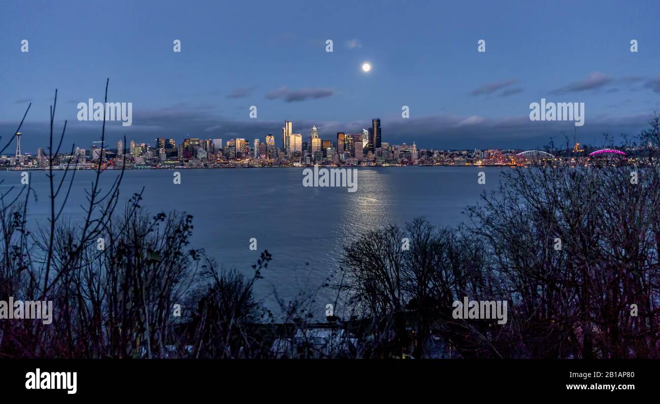A bright full moon shines over the Seattle skyline Stock Photo - Alamy