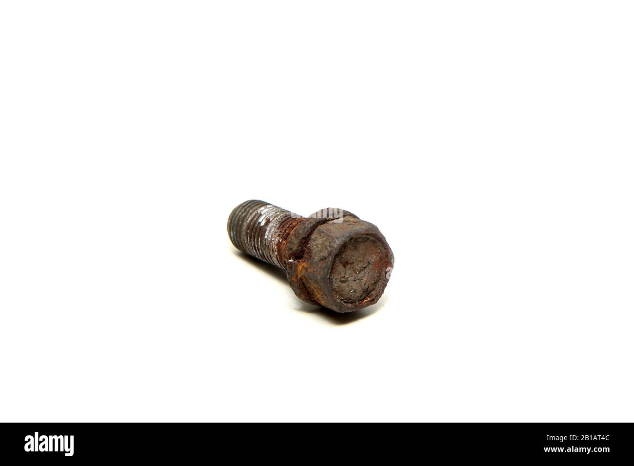A single old and rusty screw isolated on a white background Stock Photo ...