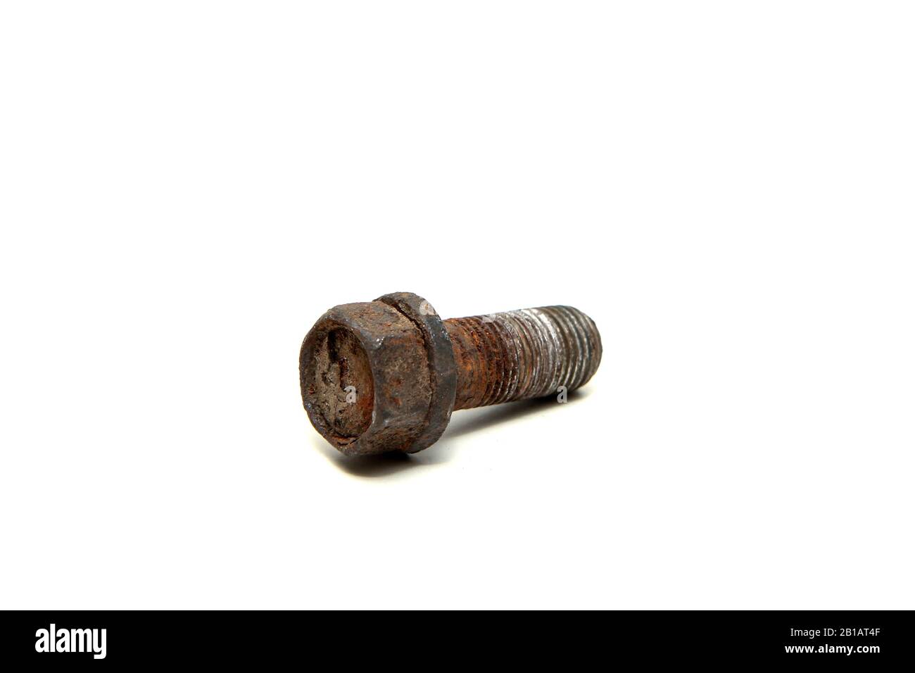 A single old and rusty screw isolated on a white background Stock Photo ...