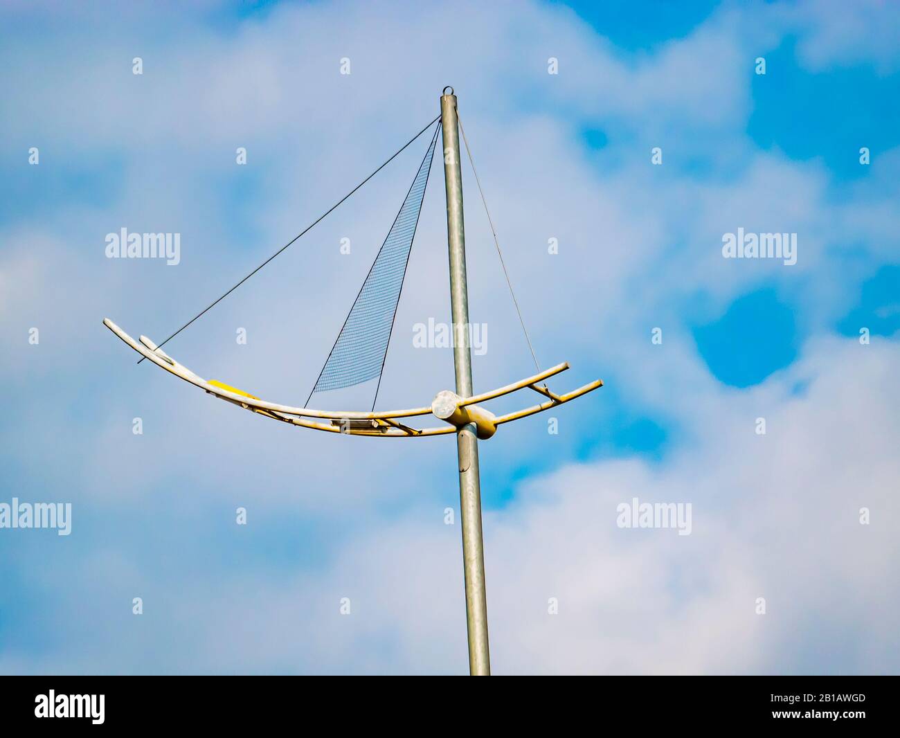 Pillar of street lighting against the blue sky Stock Photo - Alamy