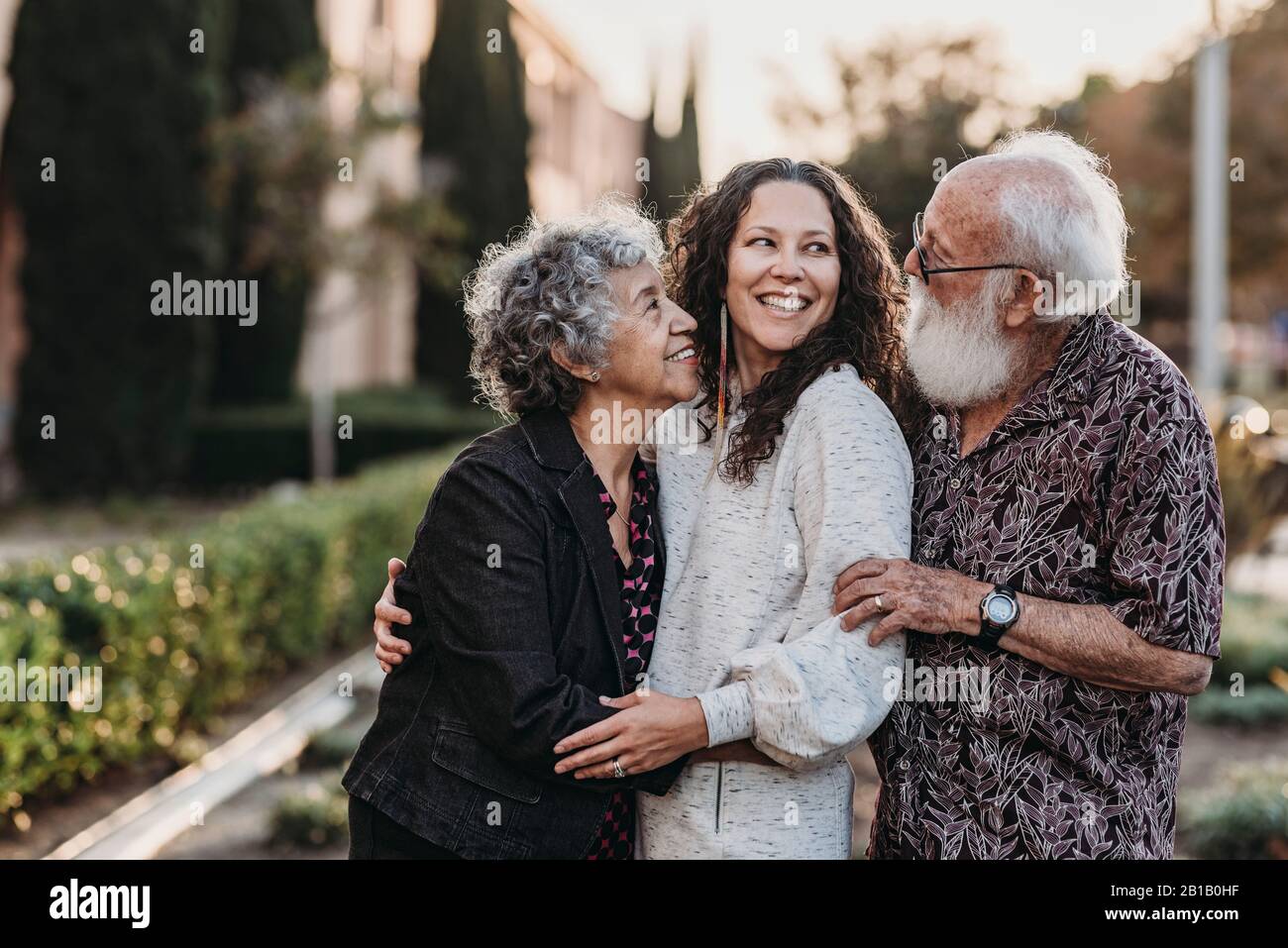 Lifestyle portrait of active senior married couple and adult daughter ...
