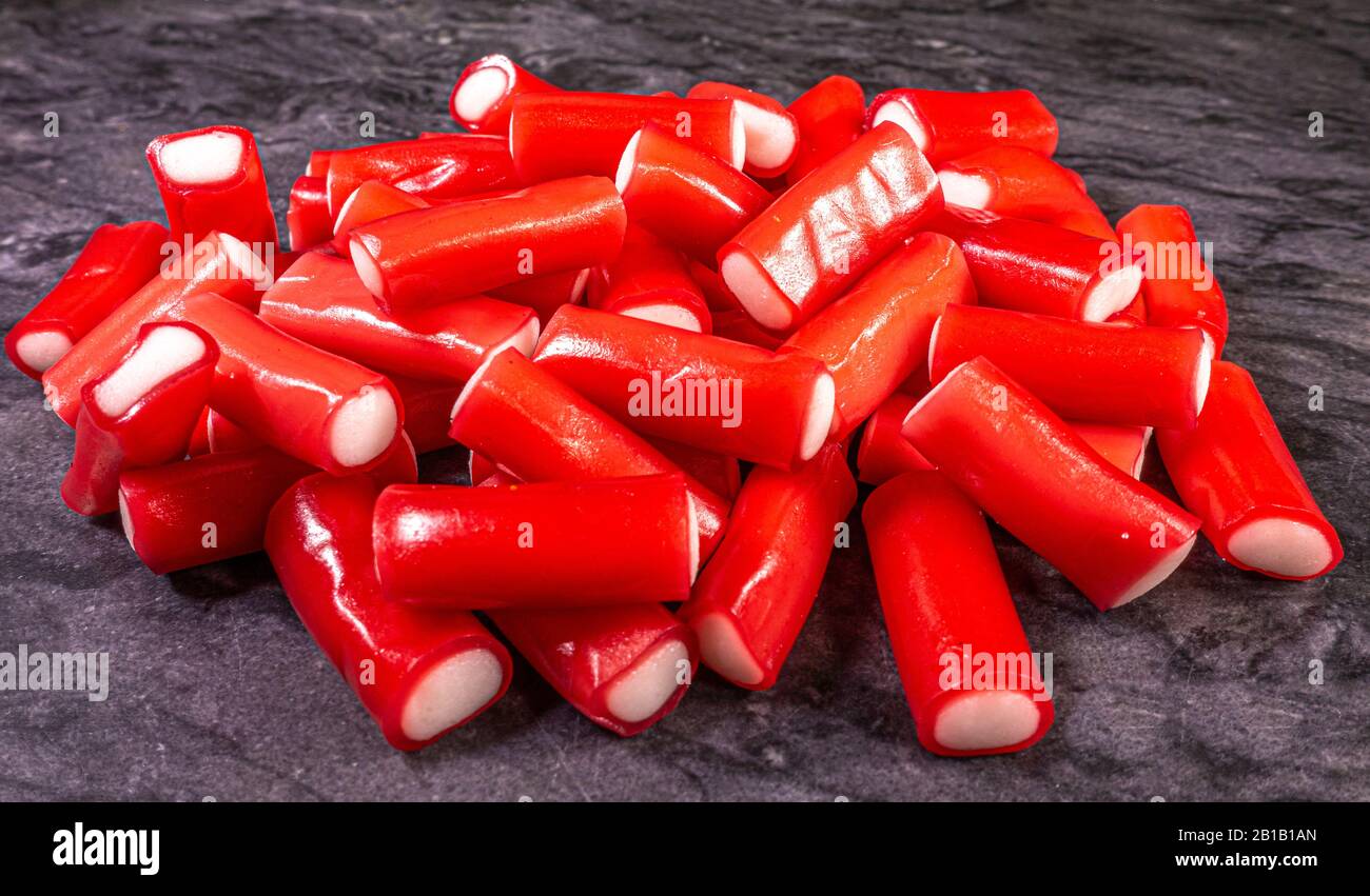 A pile of ‘strawberry pencils’ - soft and chewy, red and white, fruit ...