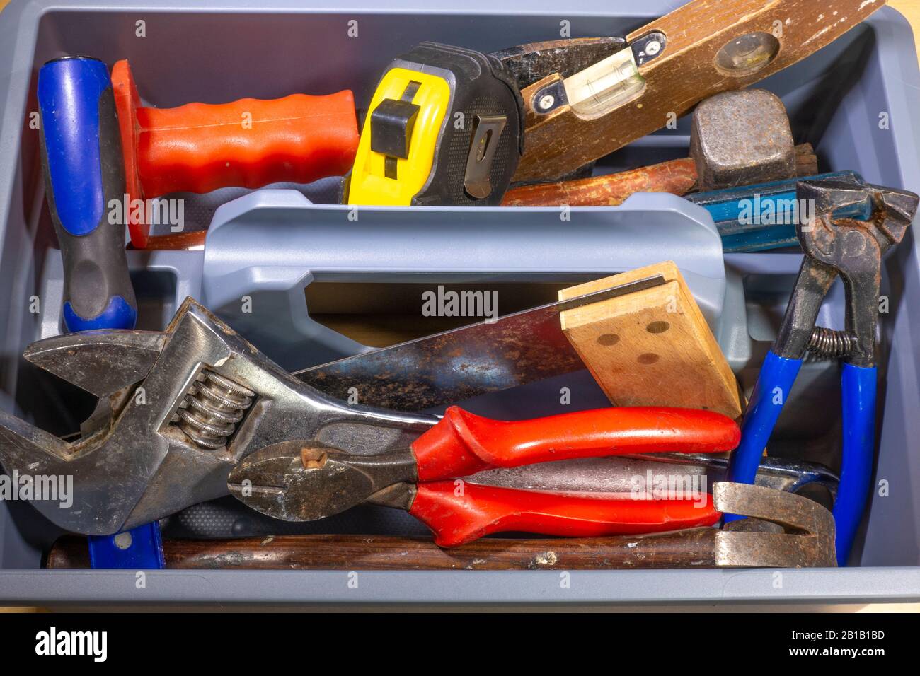 A tool tray / box, holding a variety of tools, by way of hammers ...