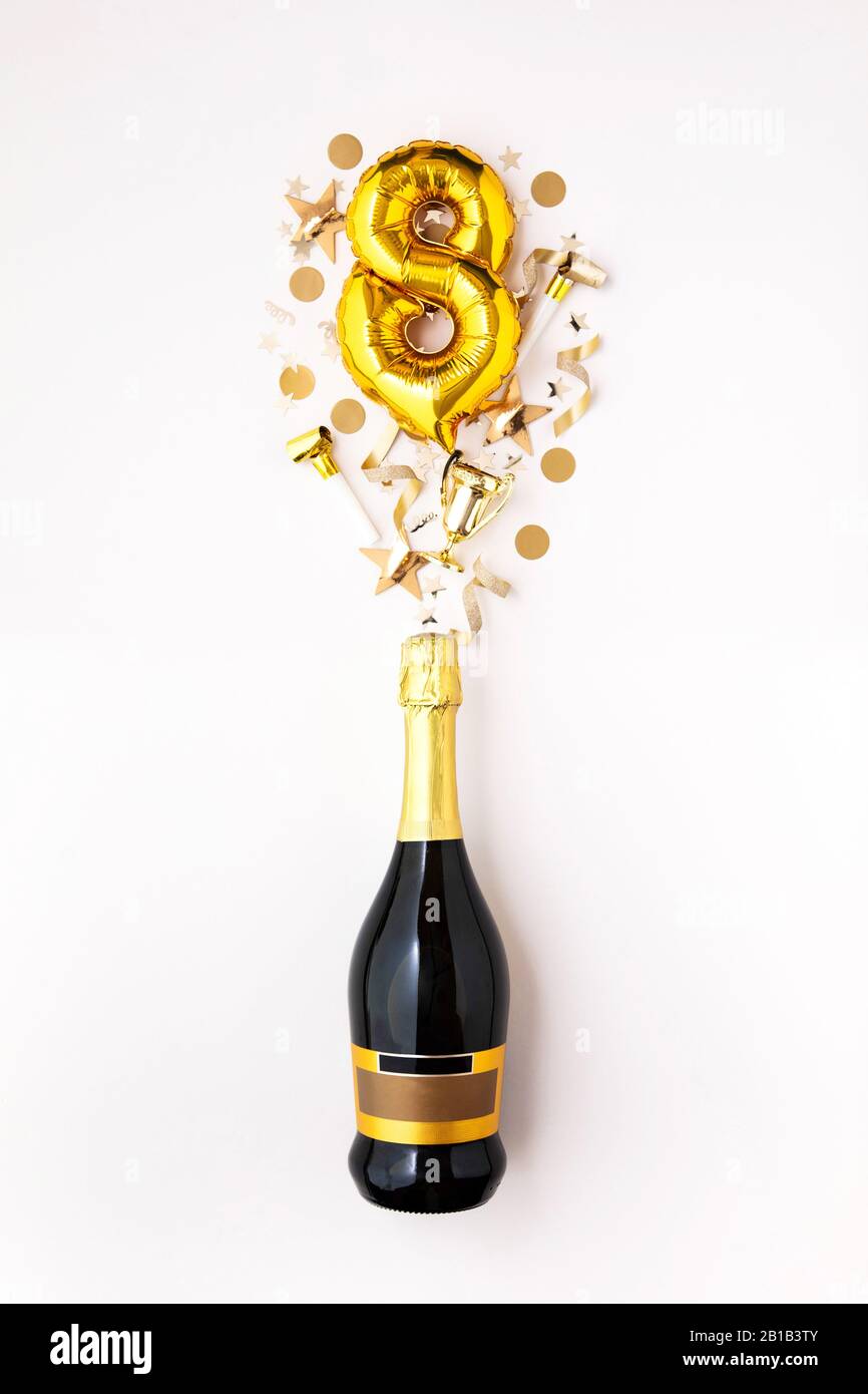 Happy 8th anniversary party. Champagne bottle with gold number balloon ...
