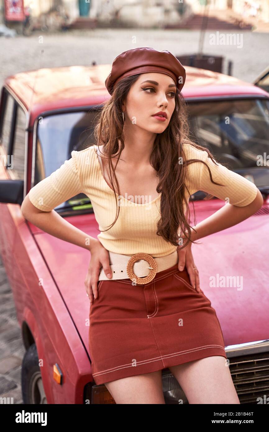 Young beautiful girl dressed in retro vintage style in the old european ...