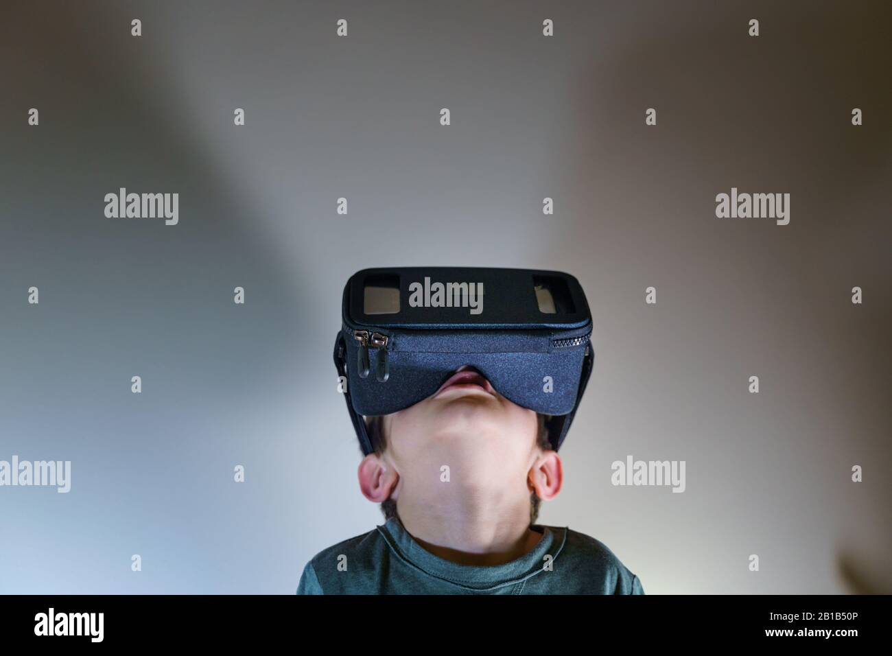 Child using new Virtual Reality, VR cardboard glasses Stock Photo - Alamy