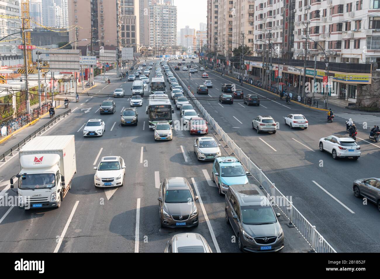 Masses of cars and buses travel on the road during rush hours in ...
