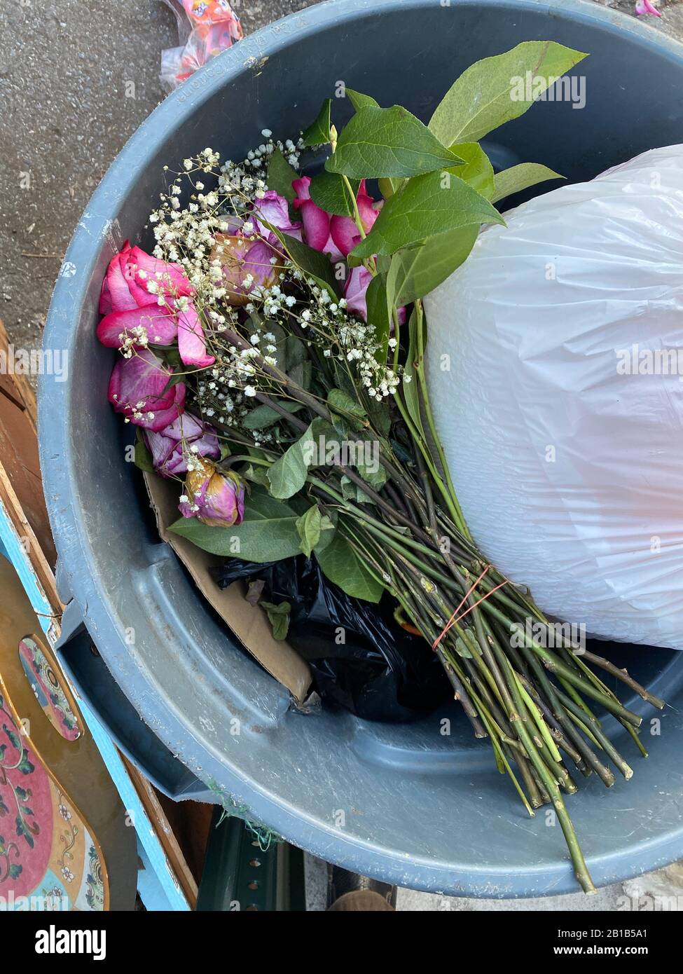 Discarded bouquet of flowers after the ceebration Stock Photo - Alamy