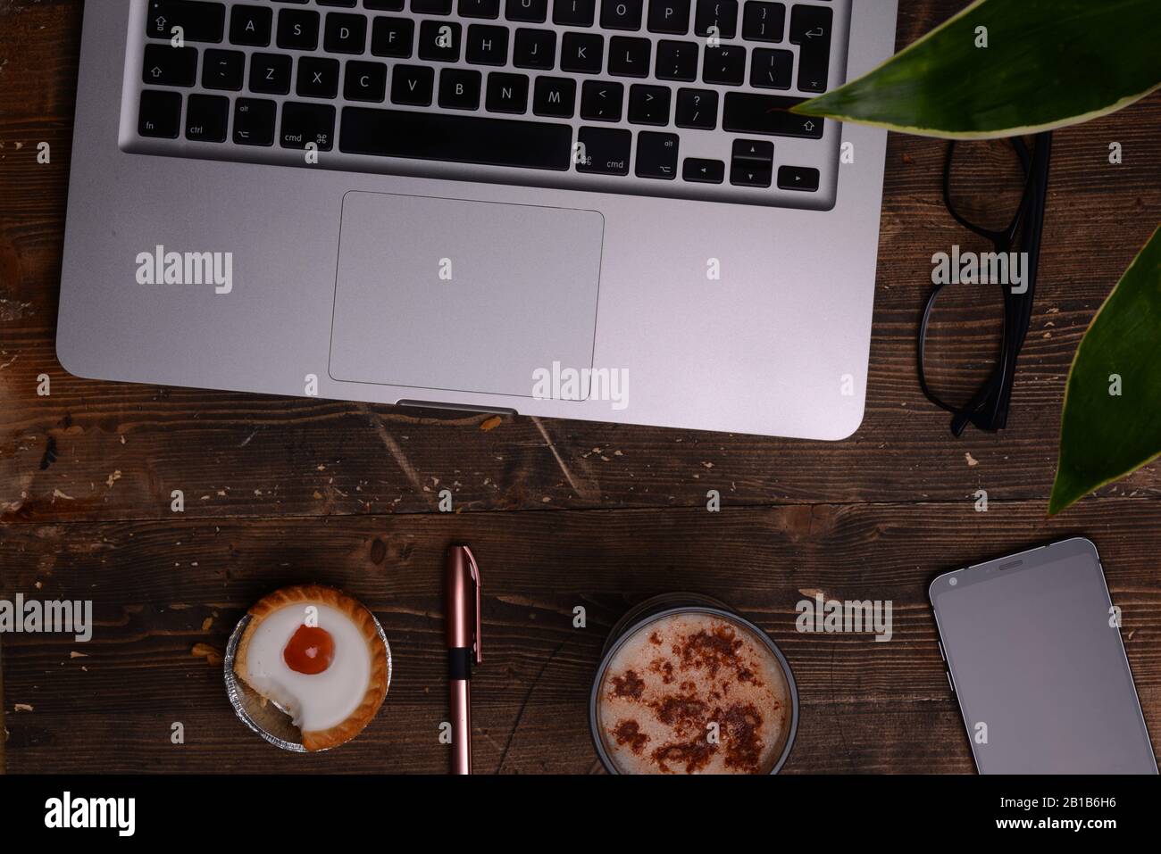 laptop on table from above Stock Photo - Alamy