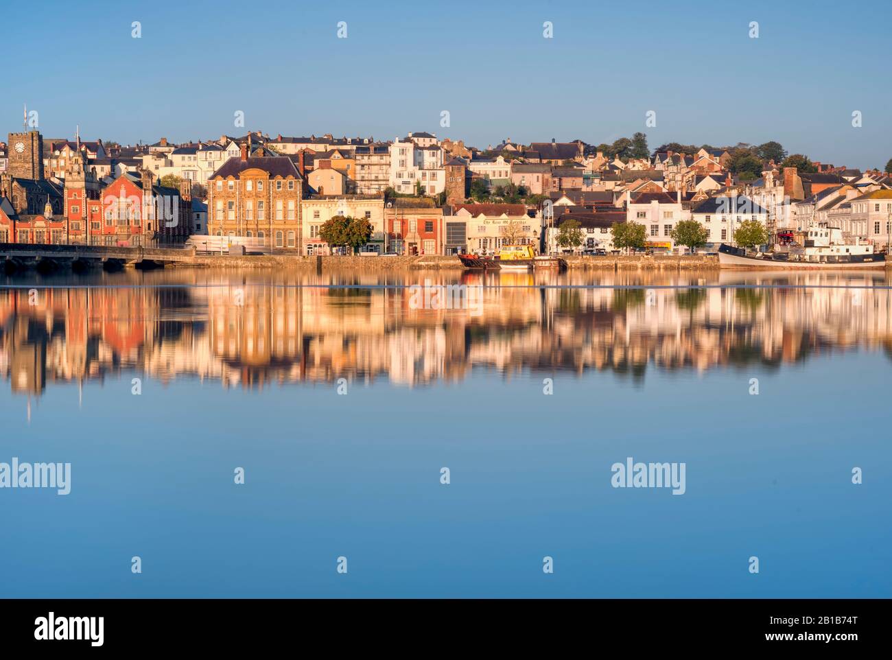 Reflections of the buildings on the quay at Bideford, North Devon in ...