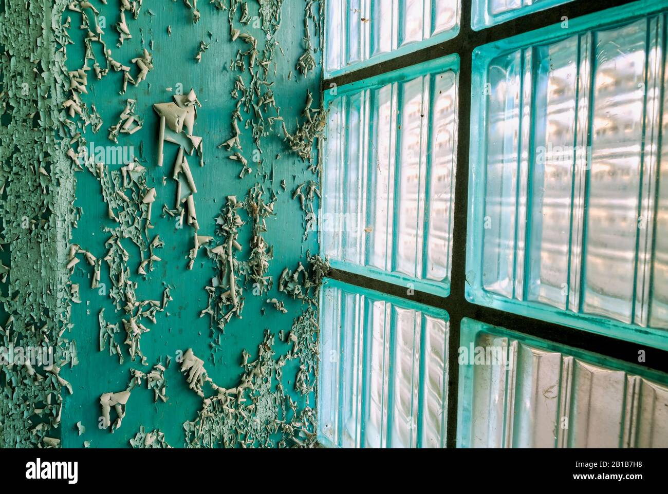 Abandoned, neglected urban buildings, with graffiti and smashed windows ...