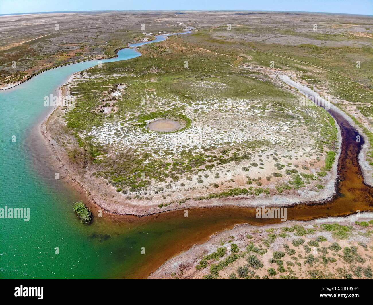 Amazing natural view taken from drone. Red water river near beautiful ...