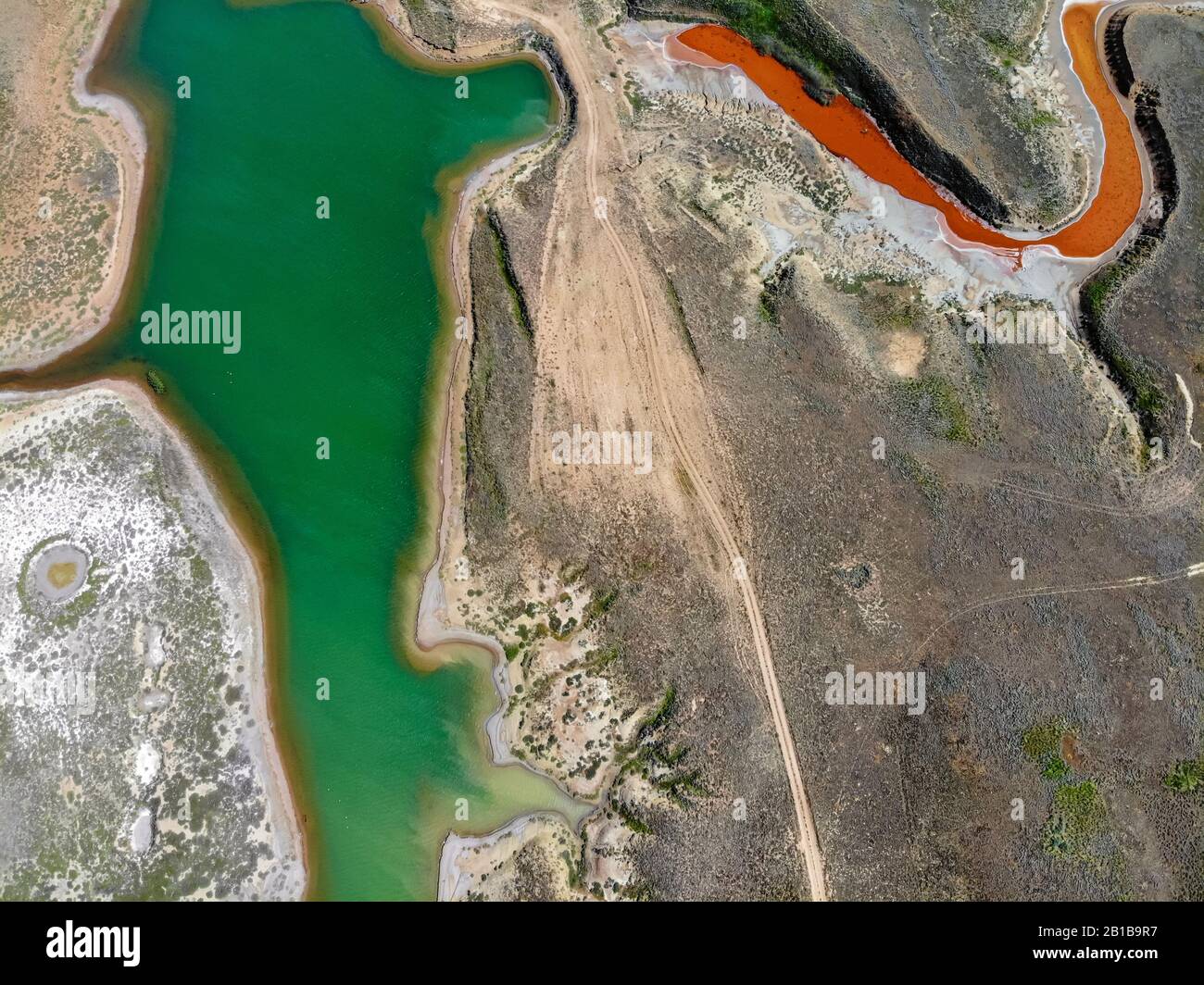 Amazing natural view taken from drone. Red water river near beautiful ...