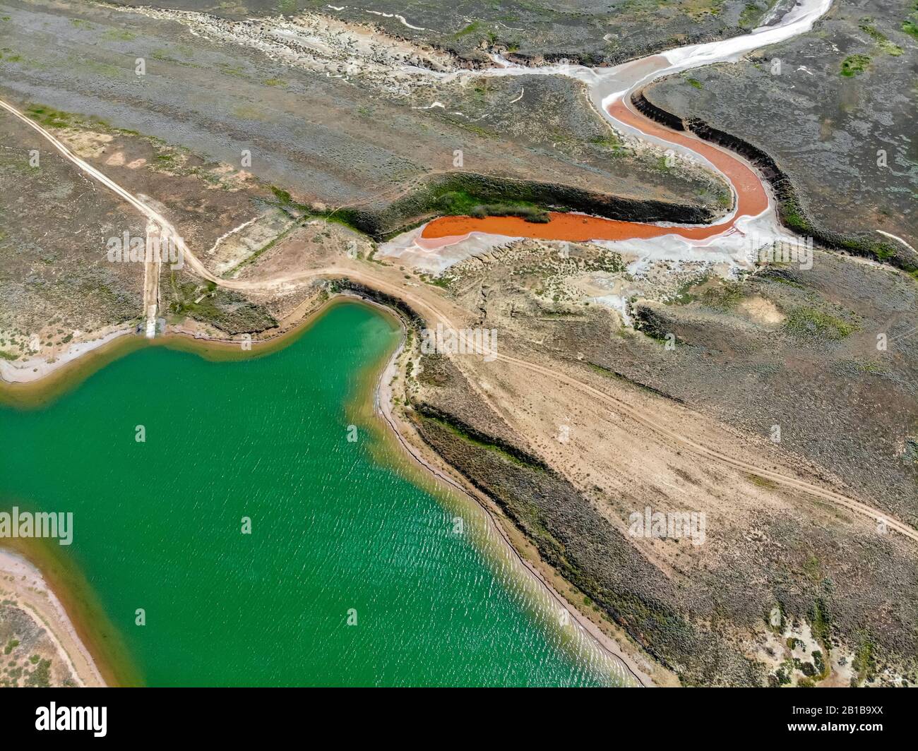 Amazing natural view taken from drone. Red water river near beautiful ...