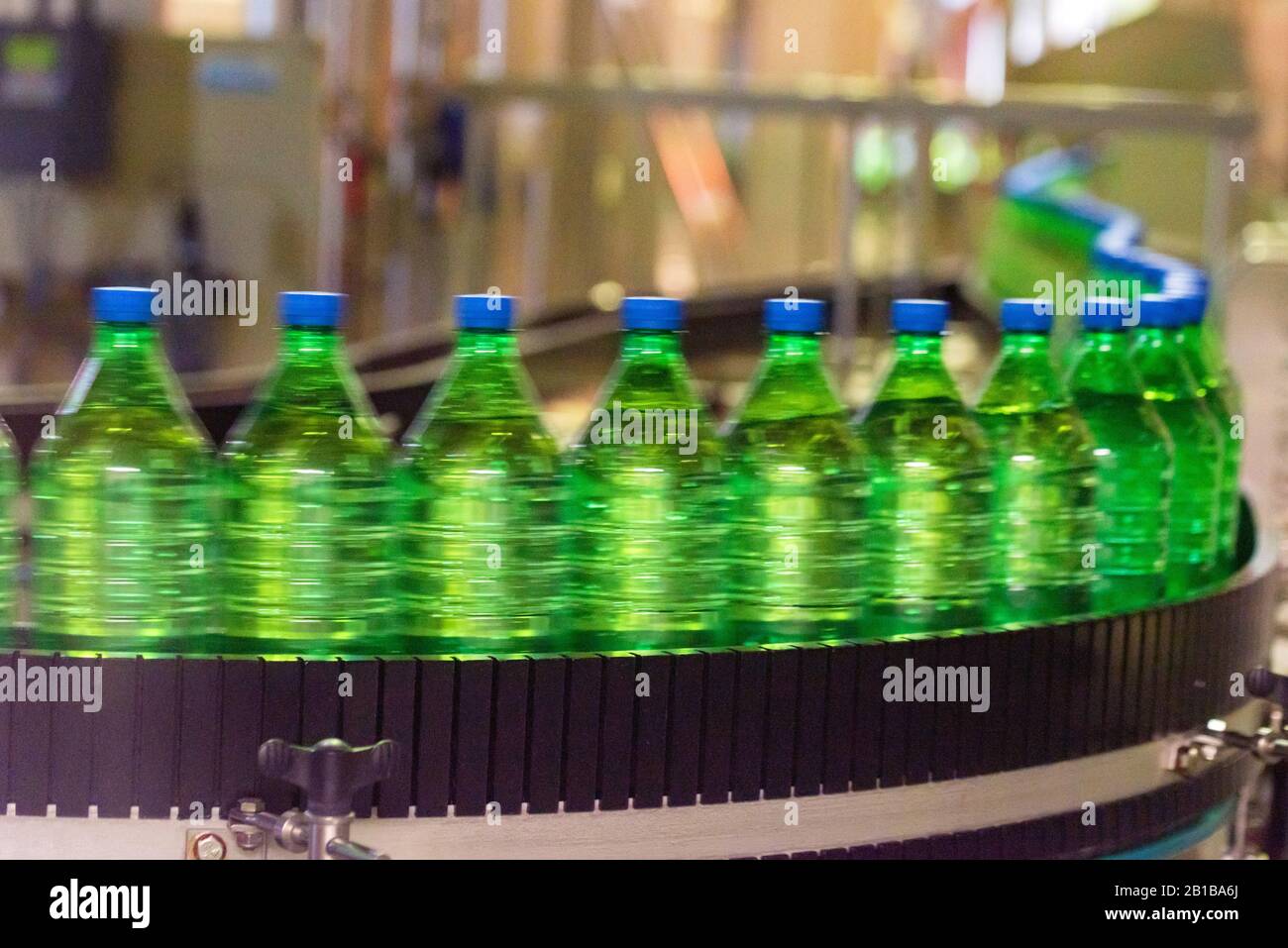 Close up bottle line at soft drinks factory Stock Photo - Alamy