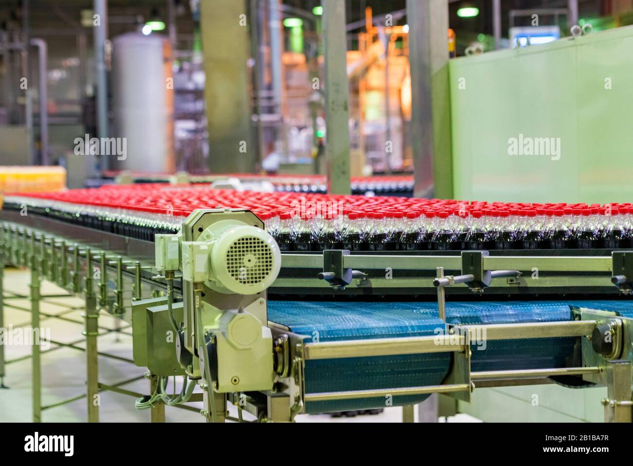 Close up bottle line at soft drinks factory Stock Photo - Alamy