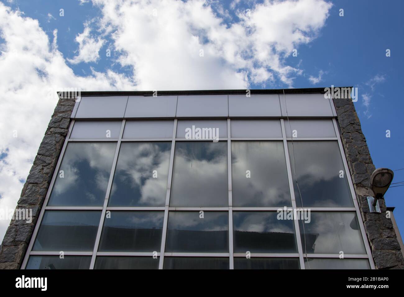 Clouds reflecting in windows hi-res stock photography and images - Alamy