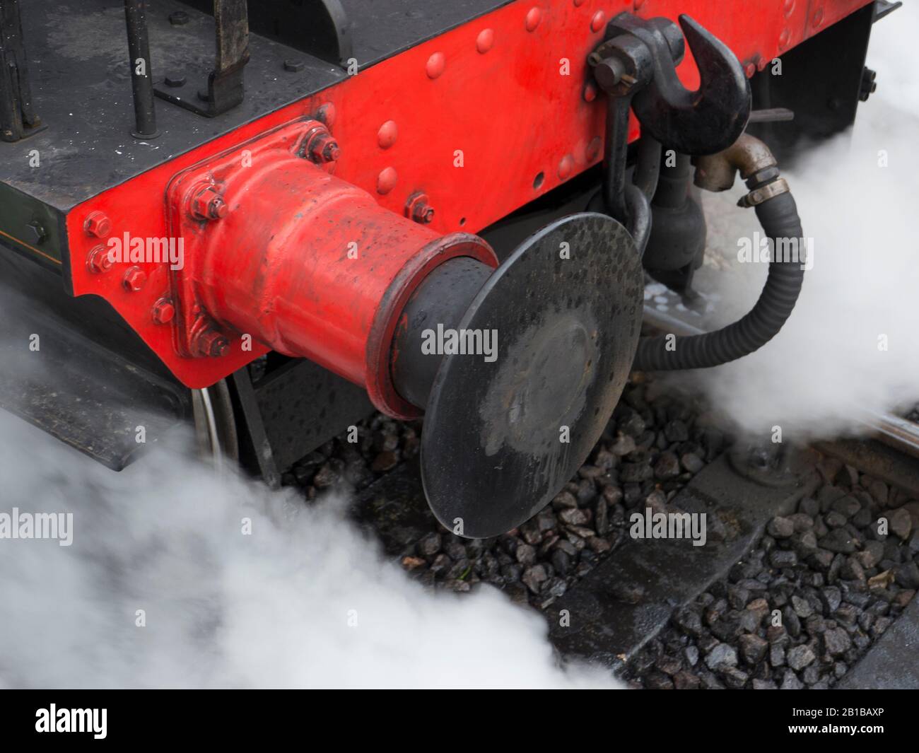 Steam train buffer . red locomottive buffer with steam emitting onto ...