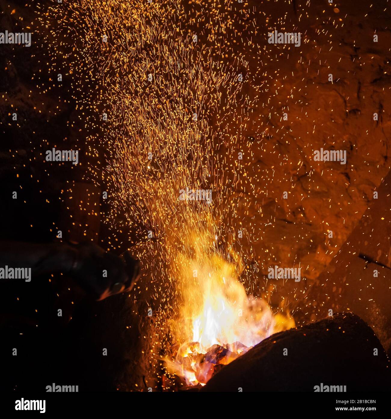 Smithy fire flame tips with sparks closeup on dark background Stock ...