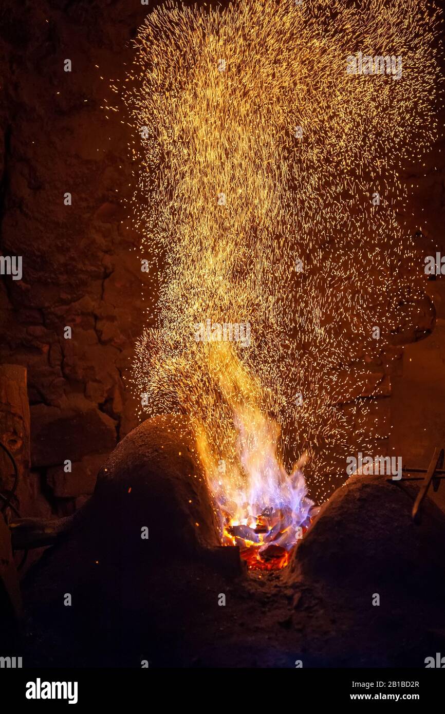 Smithy fire flame tips with sparks closeup on dark background Stock ...