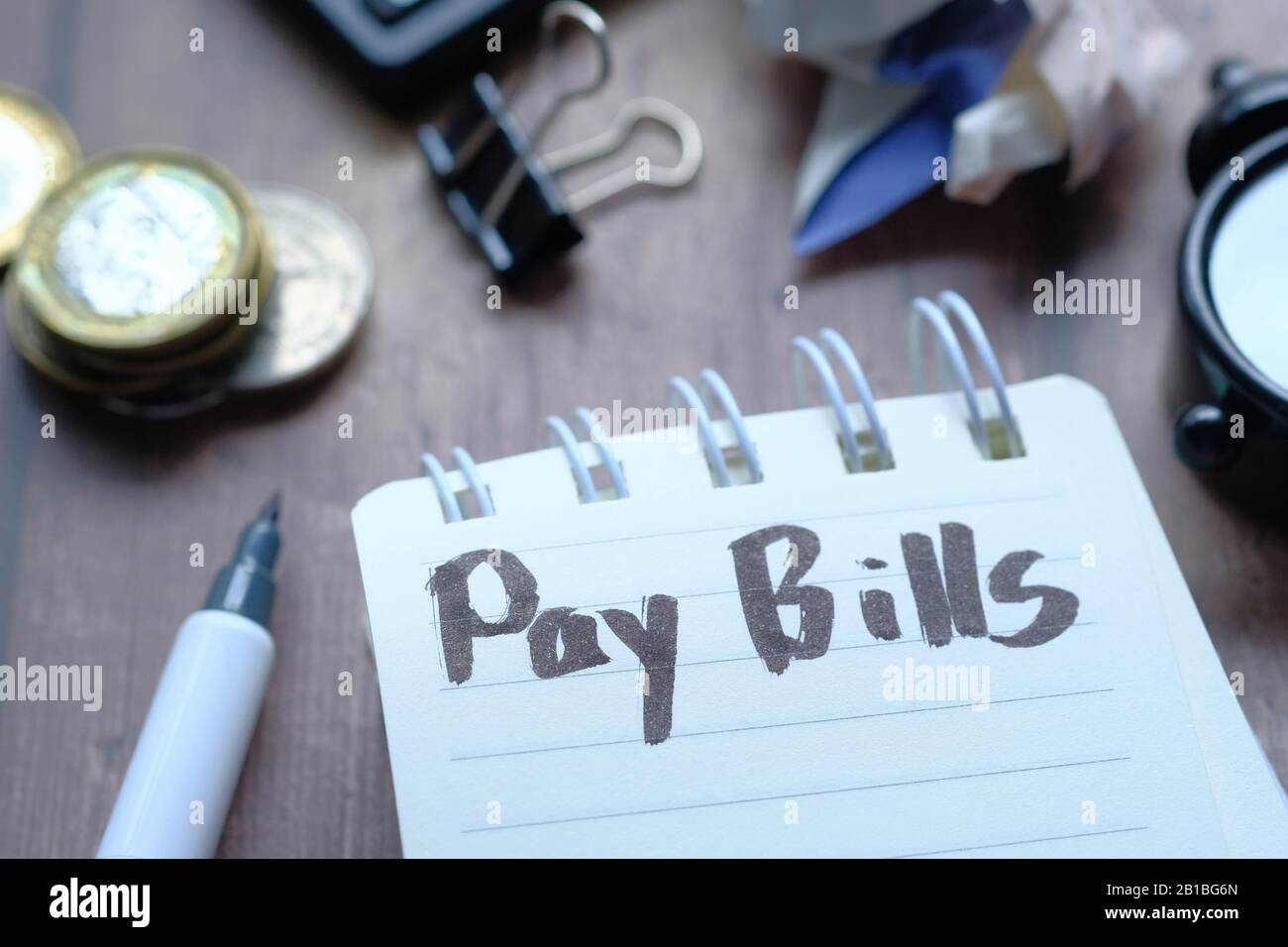 Close up of pay bills word on notepad Stock Photo - Alamy