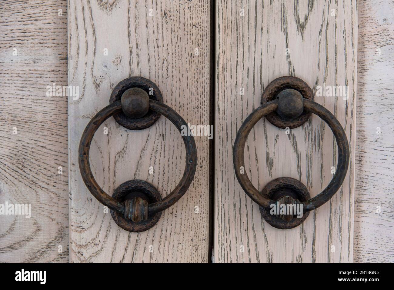 Handles On The Old-Fashioned Wooden Door Stock Photo - Alamy