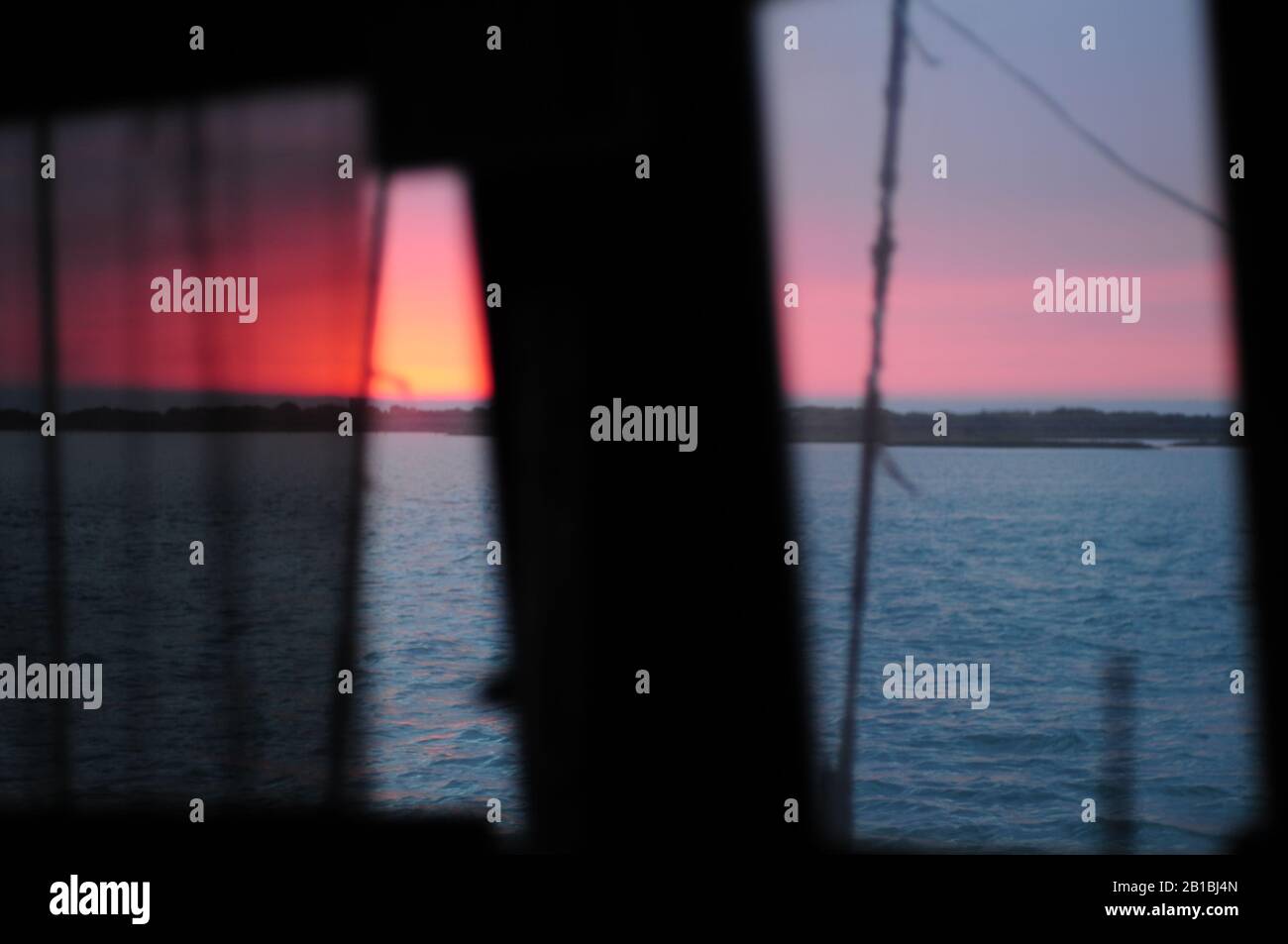 sunset through sailing boat Stock Photo - Alamy