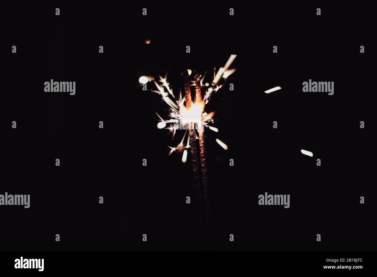 Glittering burning sparkler, abstract blur background Stock Photo - Alamy