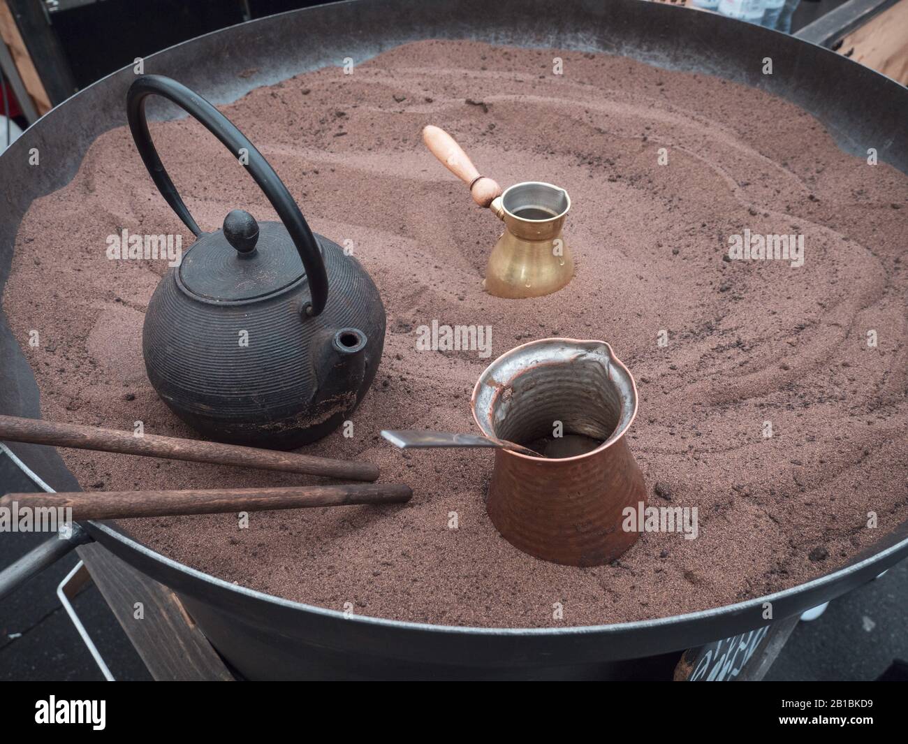 Turkish coffee made with hot sand preparation on the street during food ...