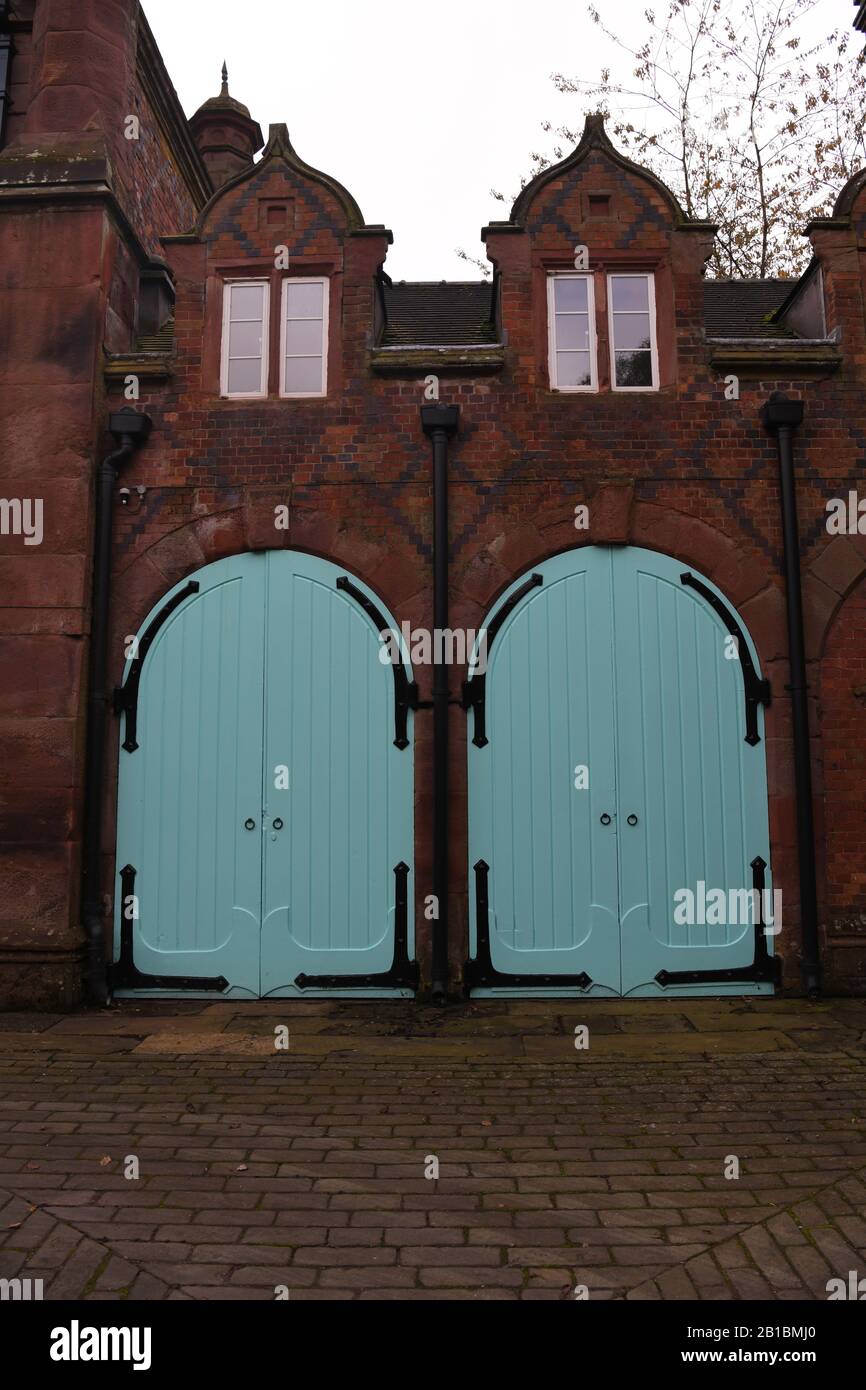 2 brightly coloured light green wooden doors at Keele University Clock ...