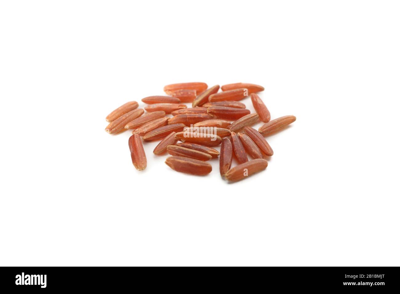 Red rice isolated on white background, close up Stock Photo - Alamy