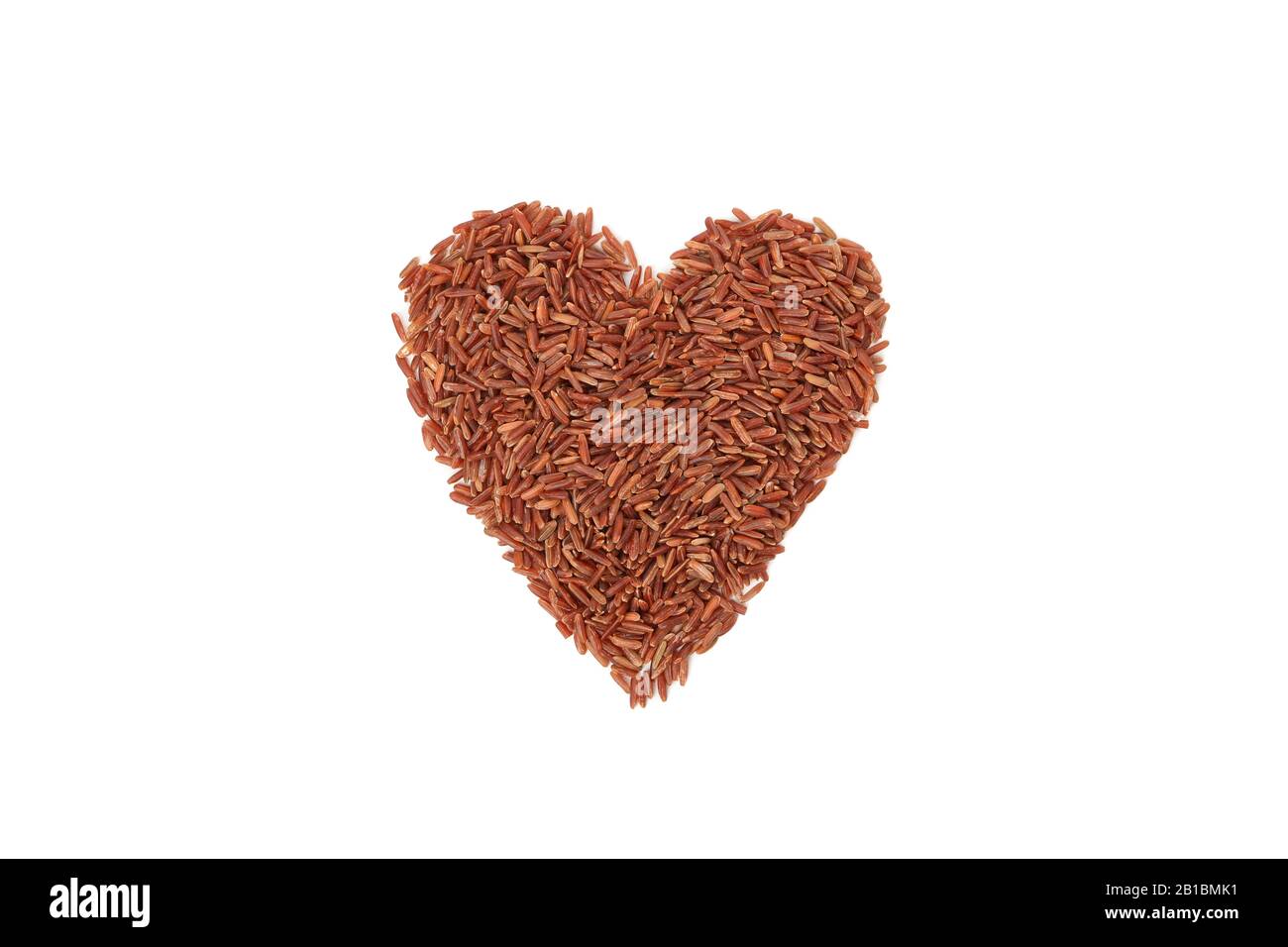 Heart made of rice isolated on white background Stock Photo - Alamy